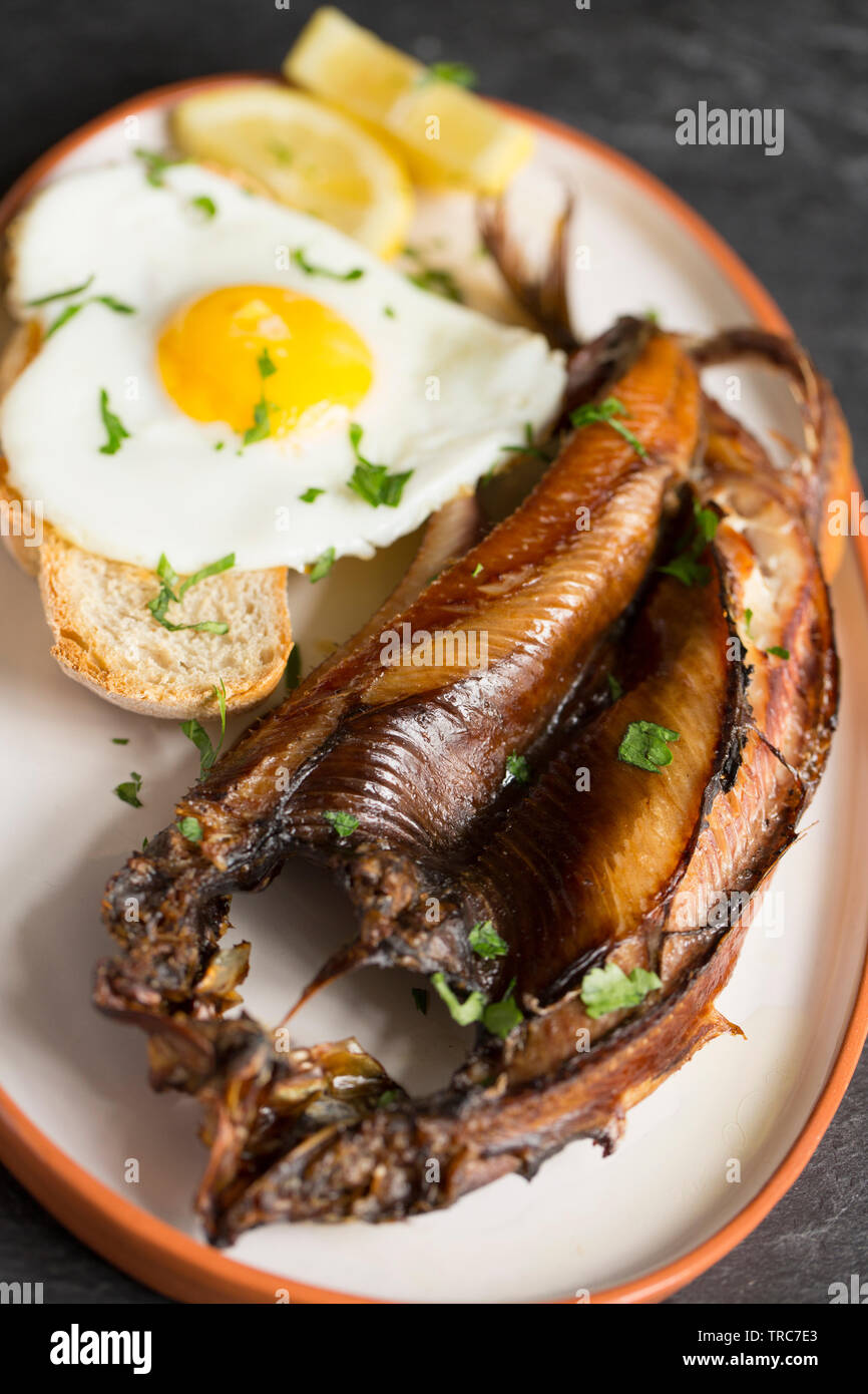 A grilled cold-smoked Craster Kipper made from an Atlantic herring ...