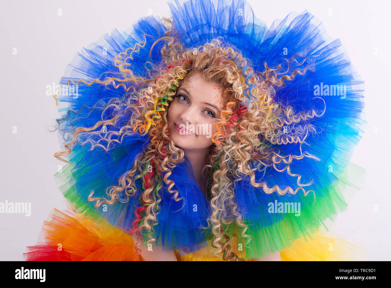 rainbow smiling girl on a white background Stock Photo - Alamy