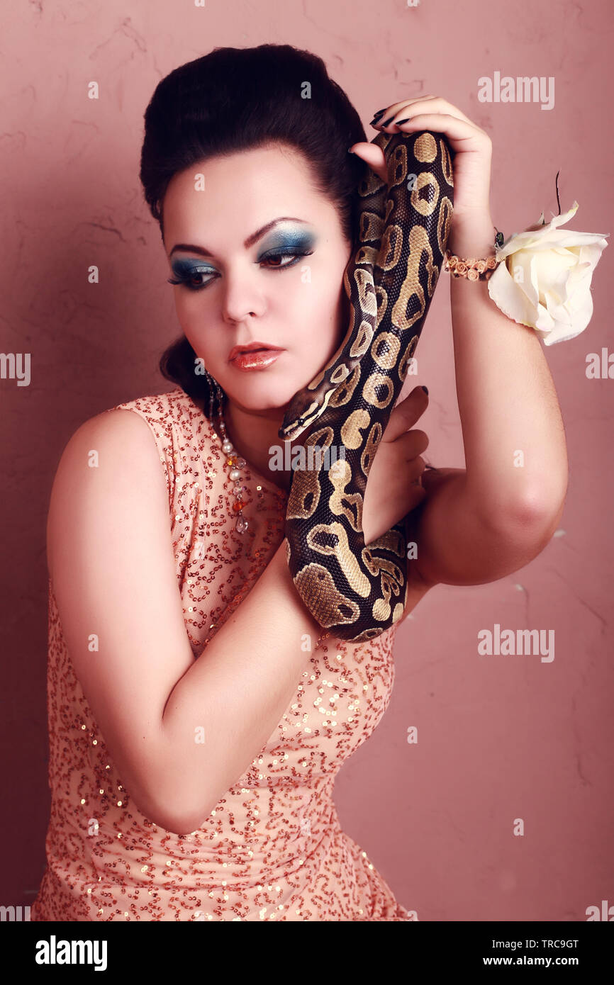 Portrait of Beautiful Woman in studio with dangerous snake Stock Photo ...