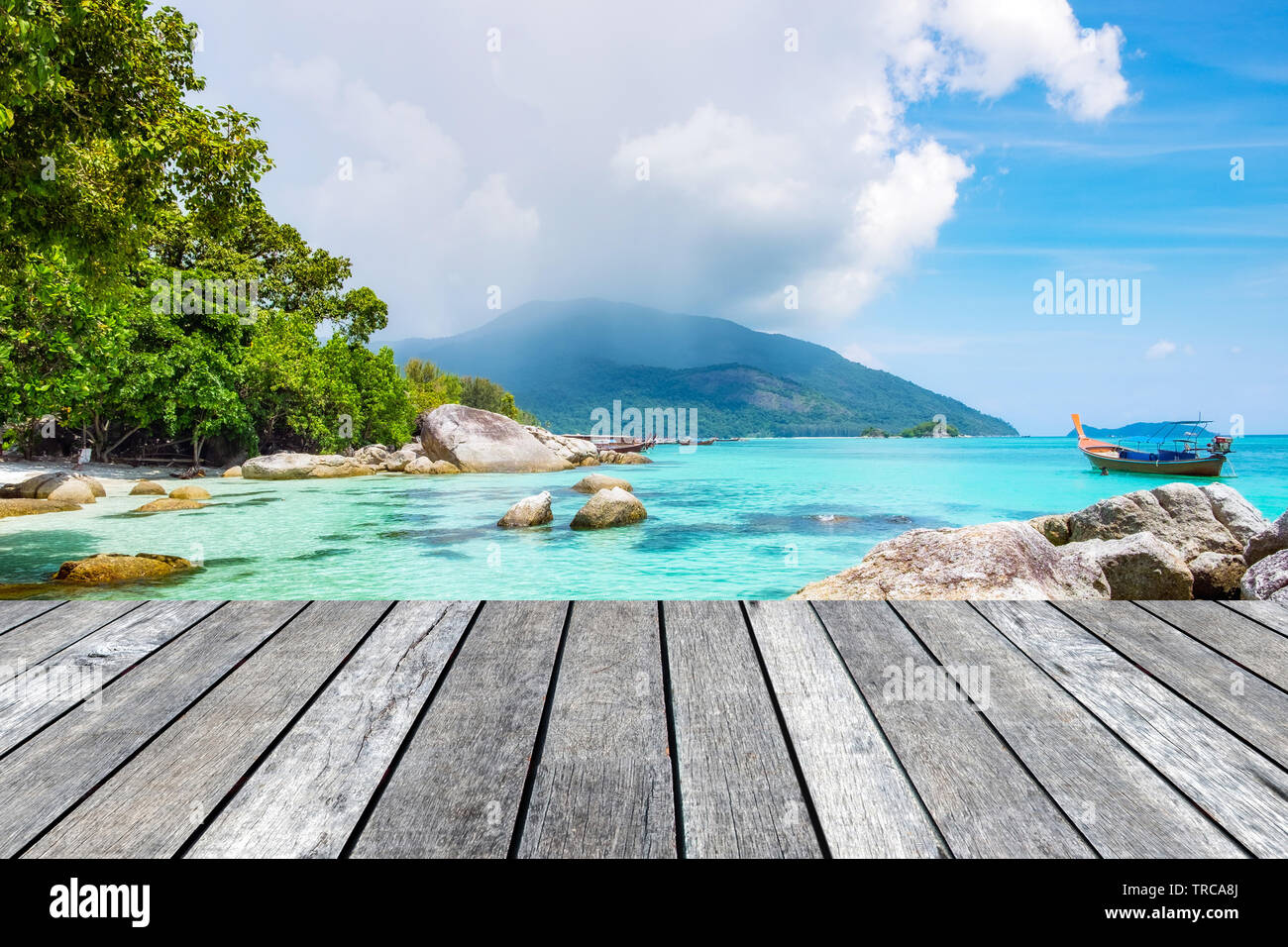 Wood plank gray on crystal sea with long tail boat in lipe island Stock ...