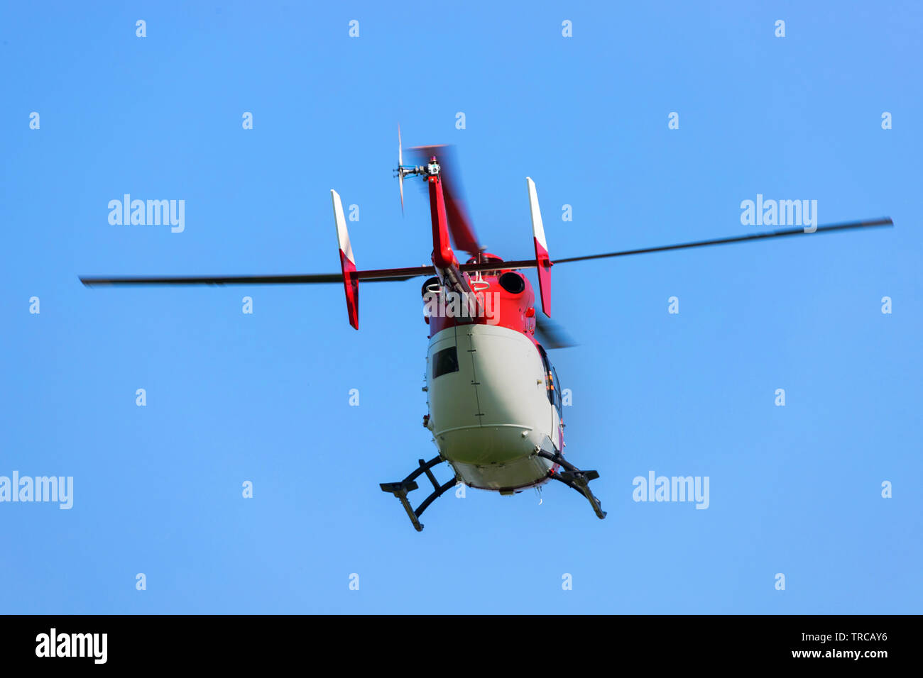 a helicopter flying from behind Stock Photo - Alamy