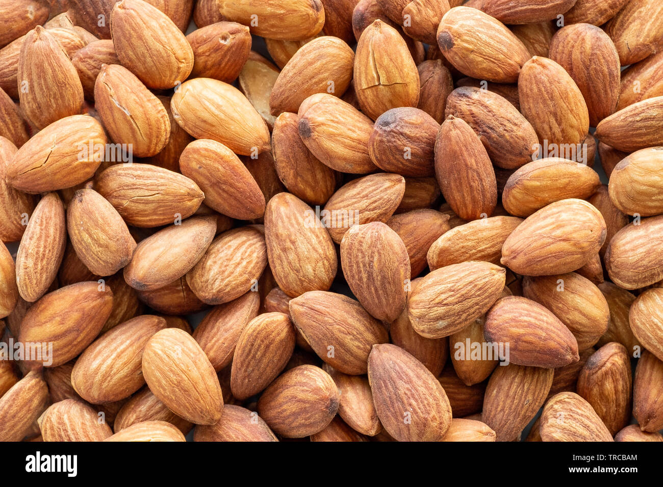 Close-up pile of peeled almond background Stock Photo - Alamy