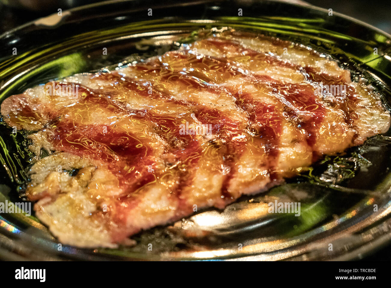 Sliced beef meat thin sorted on a plate in restaurant Stock Photo - Alamy