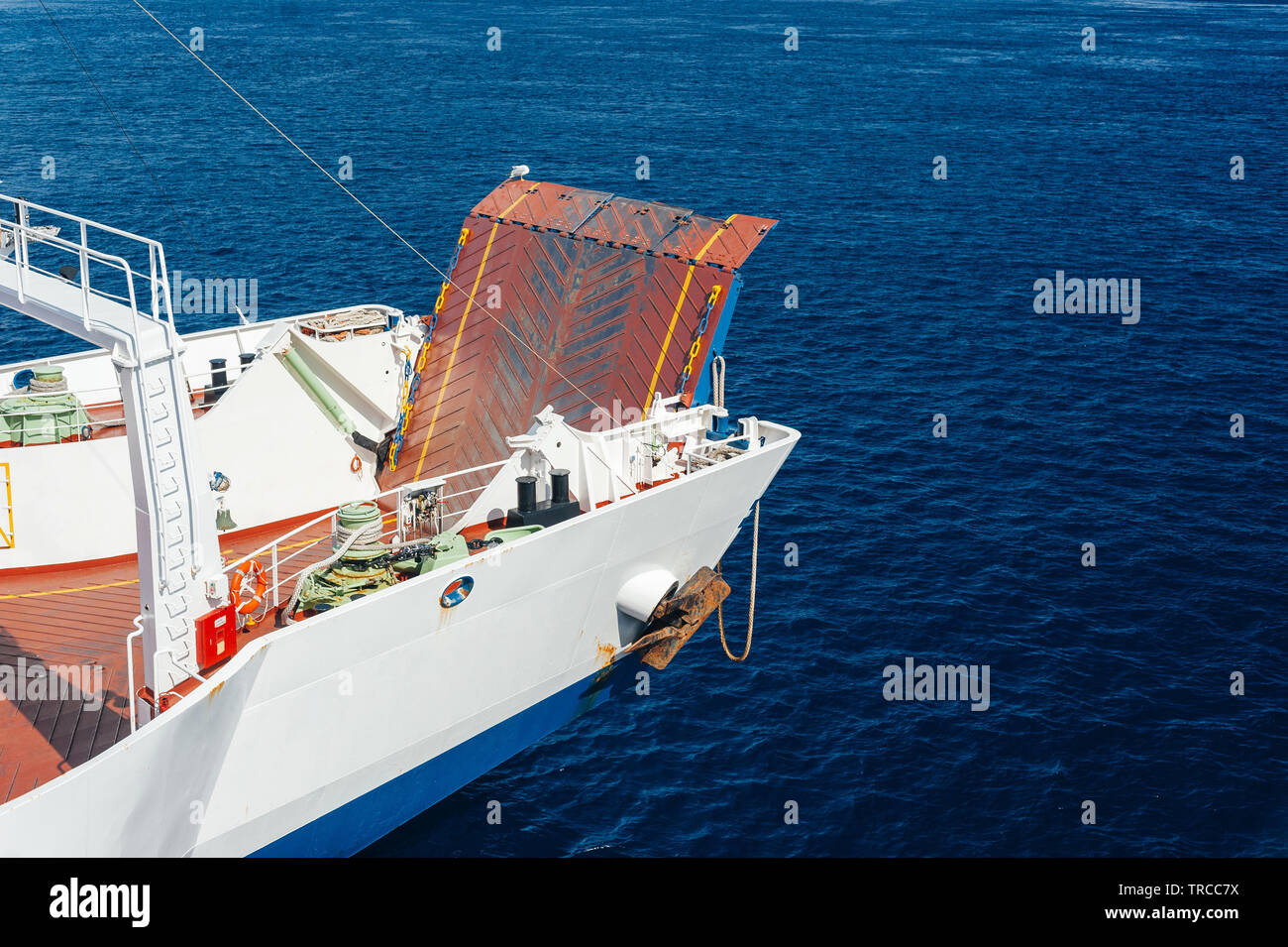 White sea ferry boat without cargo in the ocean with deep blue water in ...
