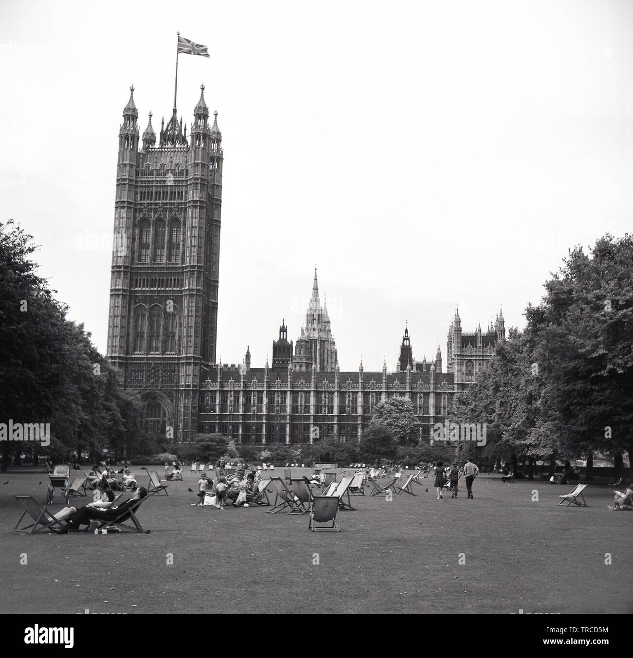 1960s, historical, view across Victoria Tower gardens with people in ...