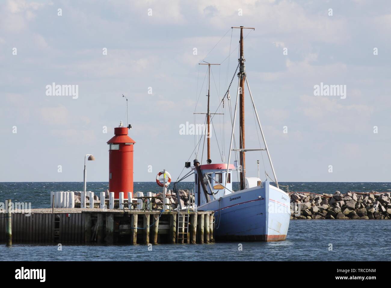 Hou lighthouse and fishing boat in Denmark Stock Photo - Alamy