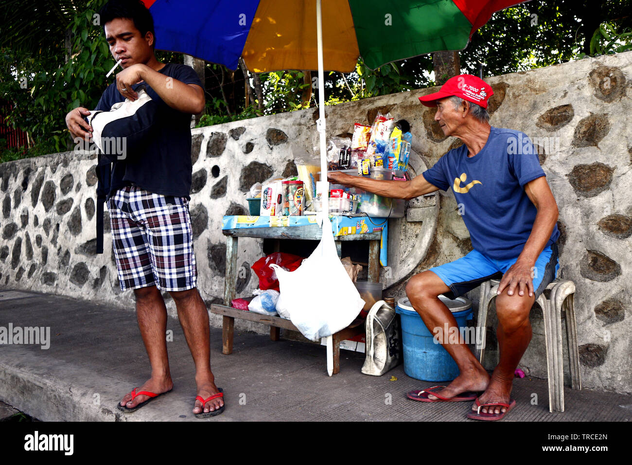 ANTIPOLO CITY, PHILIPPINES – MAY 31, 2019: A street vendor sells ...