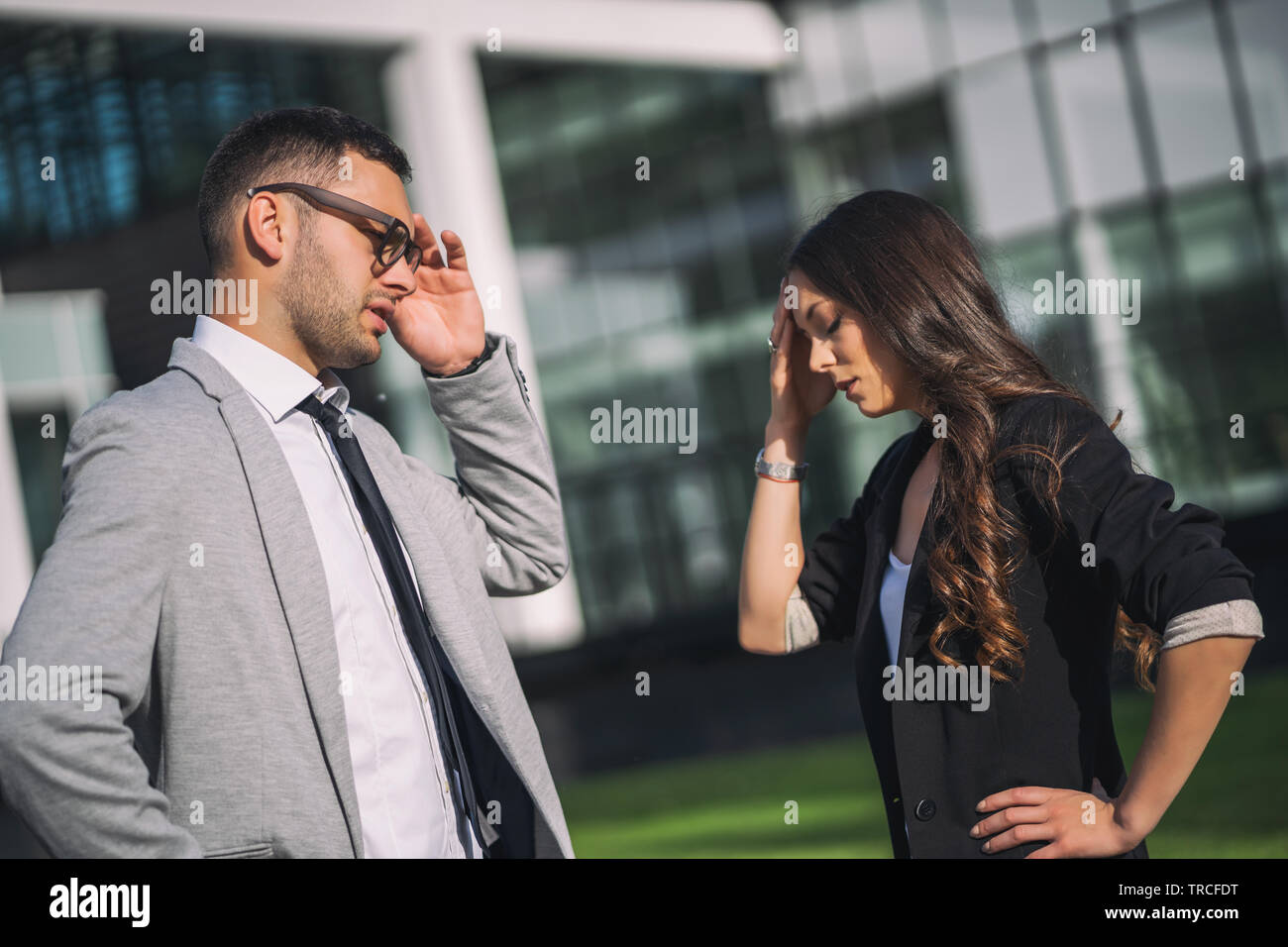 Overworked business people is talking to colleague after work Stock ...