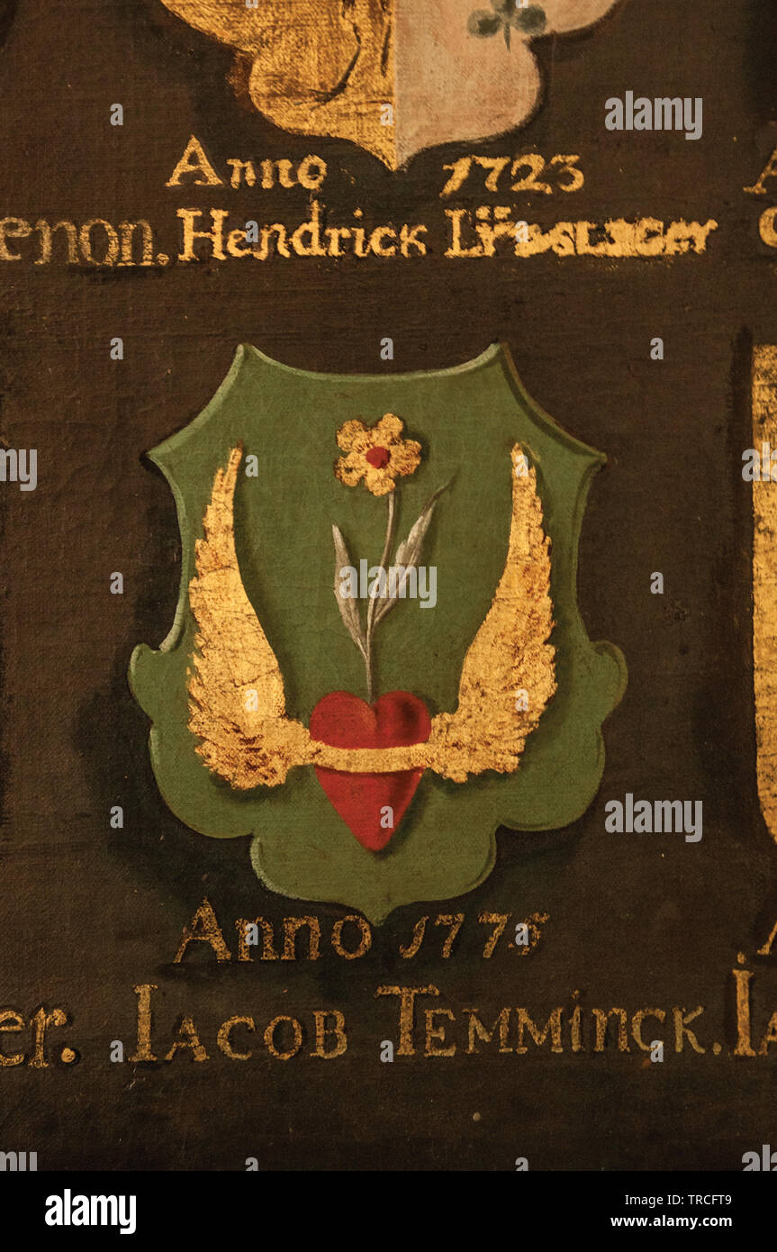 Detail of elegant family crest painted in old church frame in Amsterdam ...