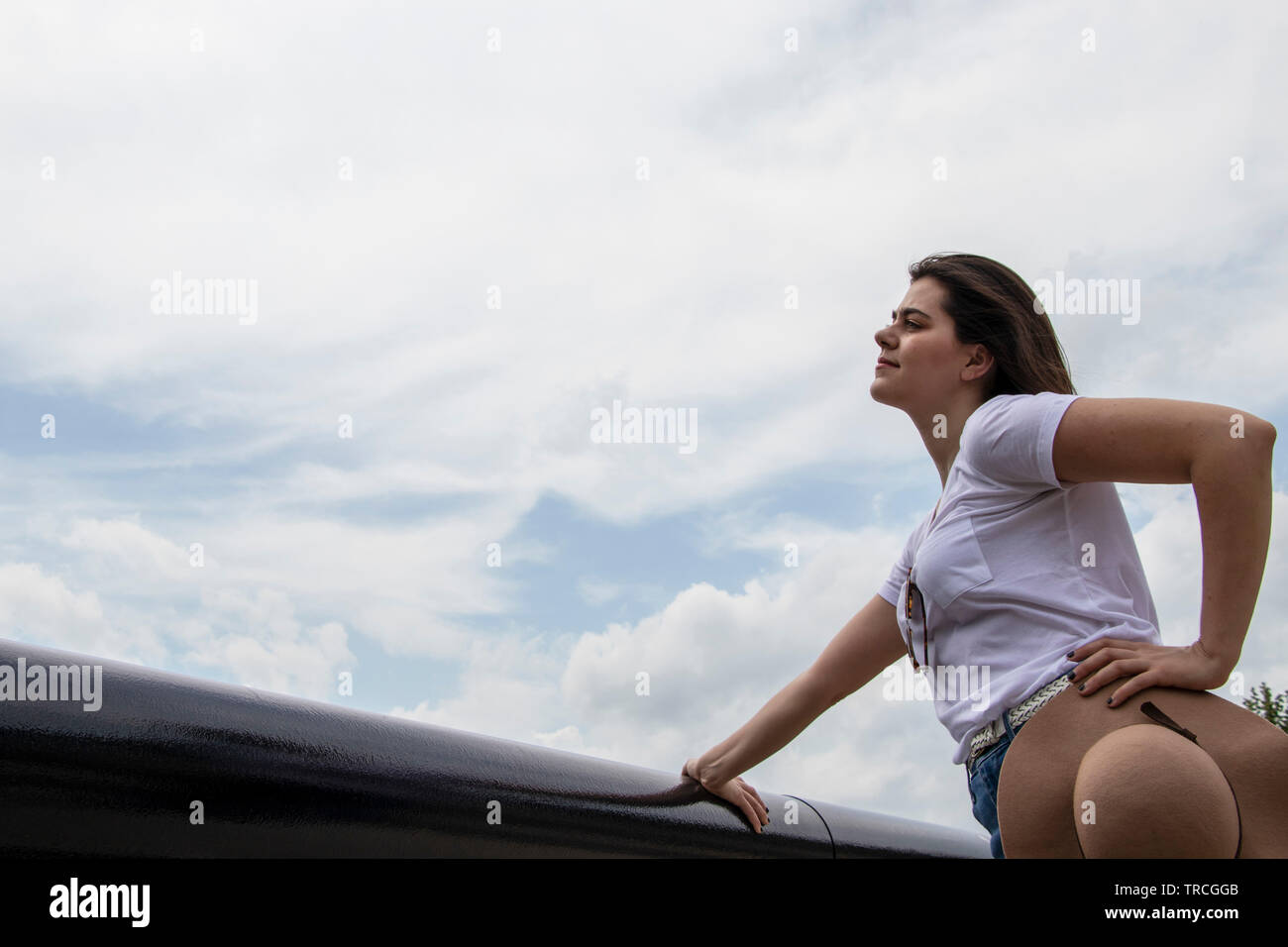 Woman looking out over the river Stock Photo - Alamy