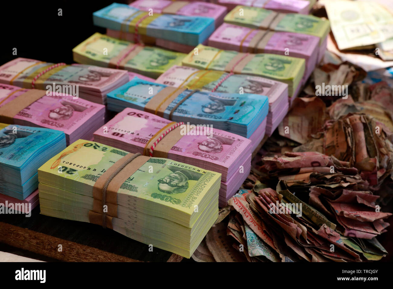 Dhaka, Bangladesh - June 03, 2019: Vendors showcase crisp new notes for ...