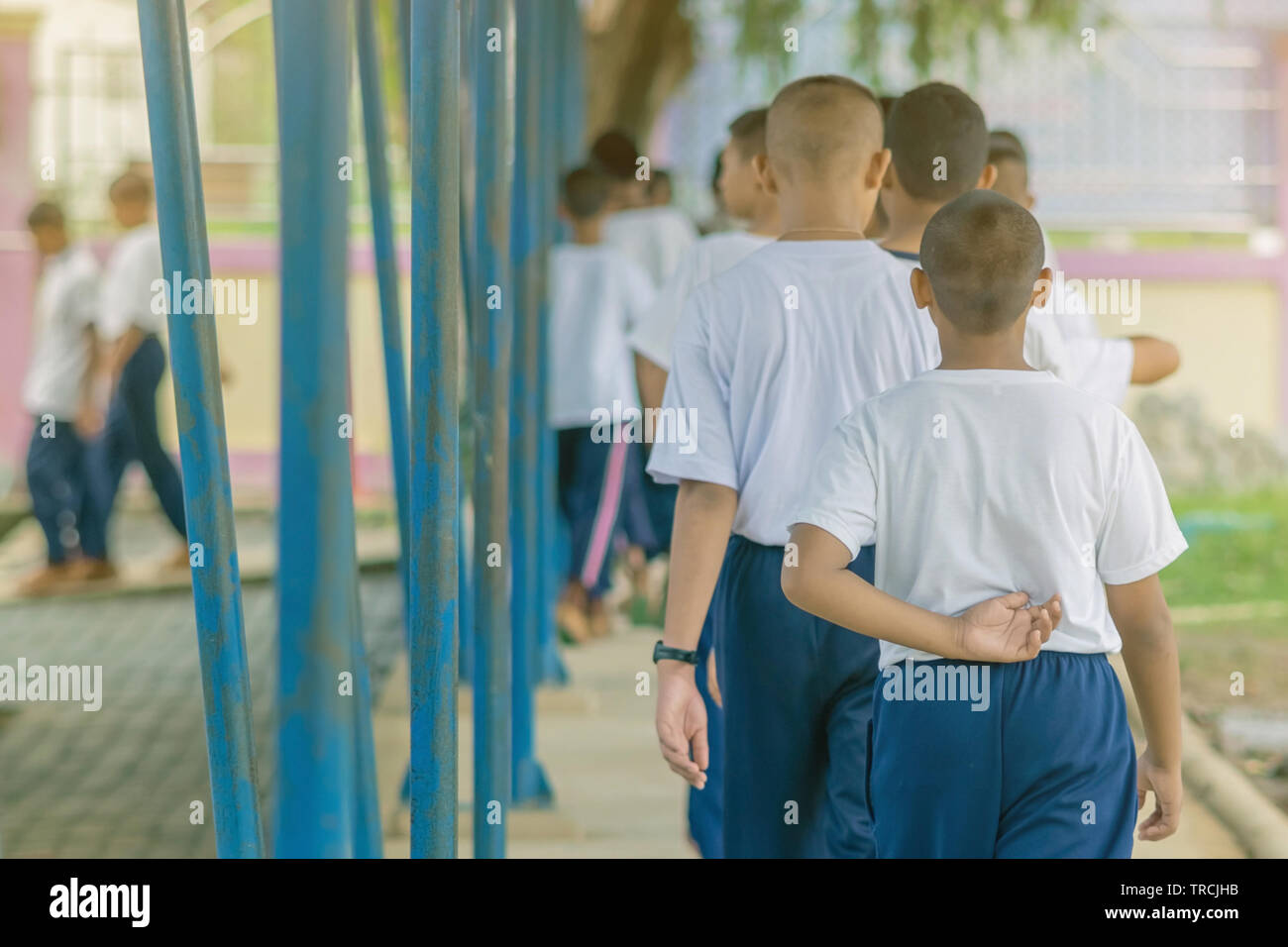 Group of students try to meditate for the peace of mind by walk with ...