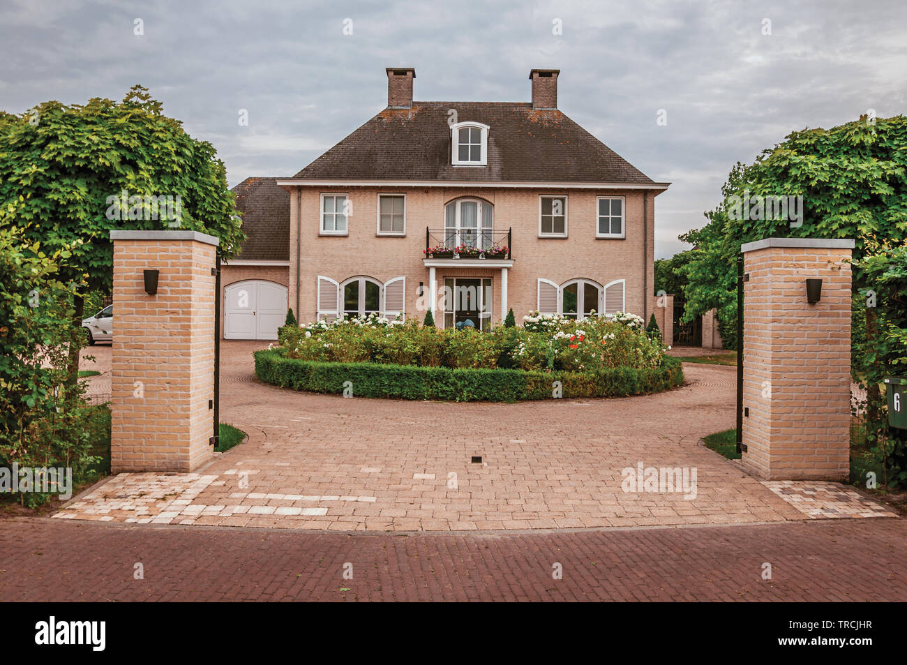 Small brick home with a gate hi-res stock photography and images - Alamy