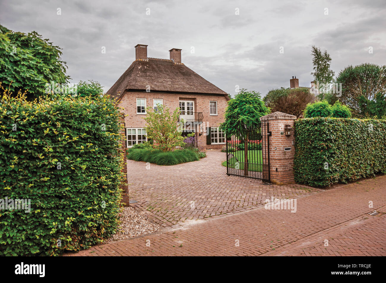 Small brick home with a gate hi-res stock photography and images - Alamy