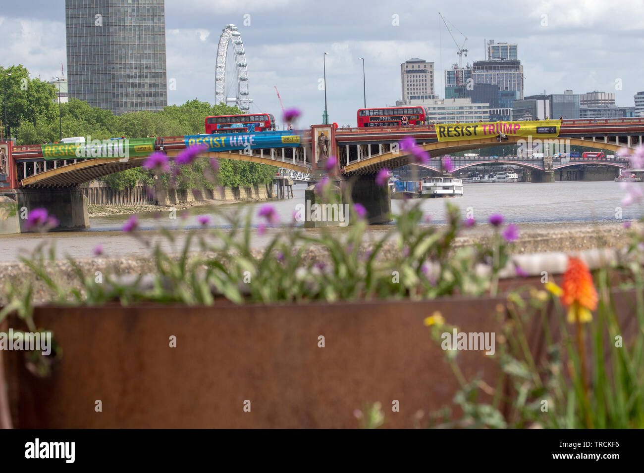Amnesty International unfurls giant “Resist” banners in front of the US ...