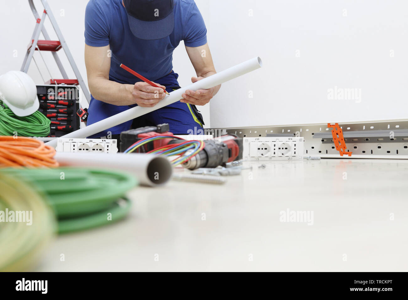 Man ladder fixing cables hi-res stock photography and images - Alamy