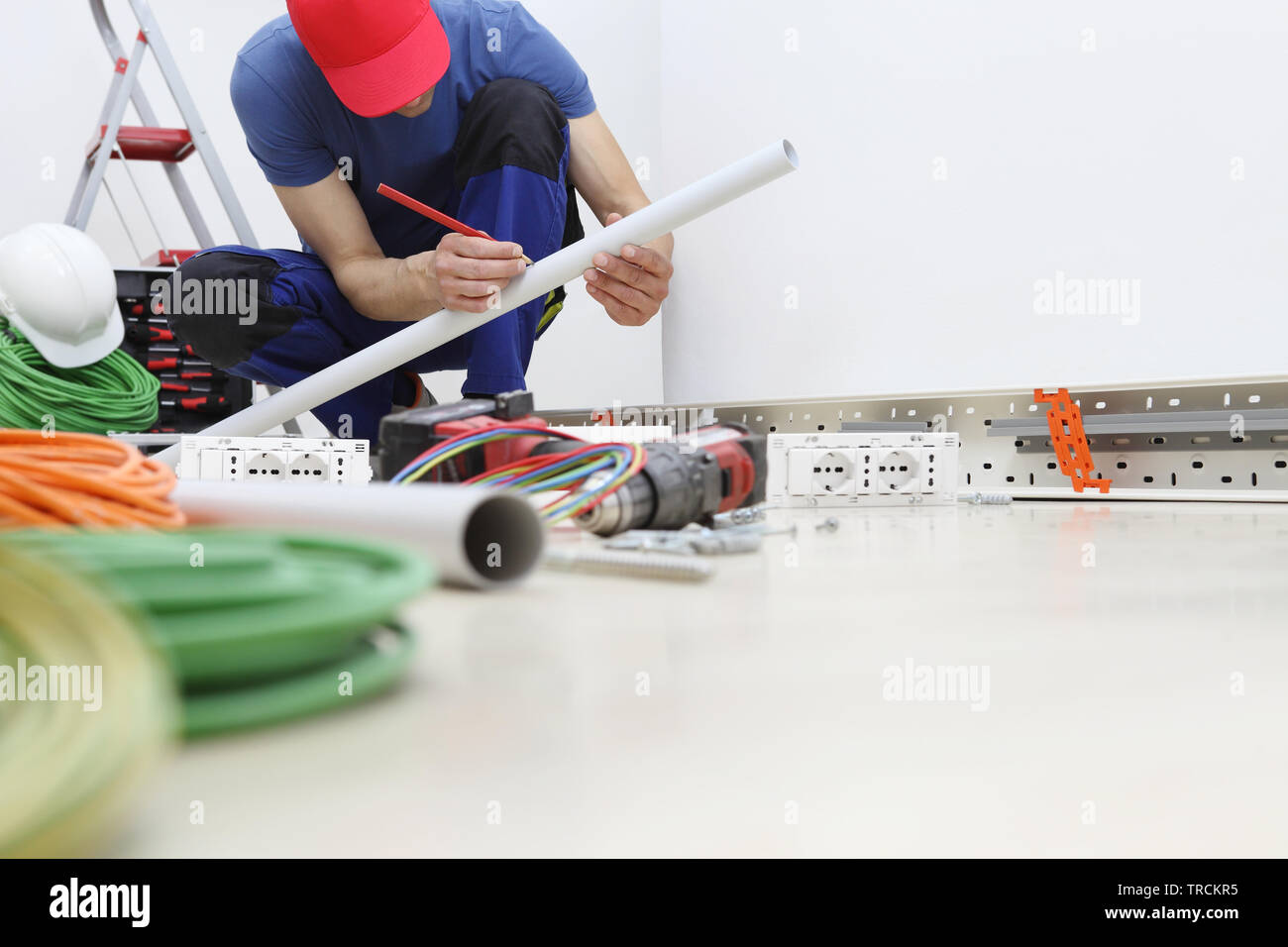 Man ladder fixing cables hi-res stock photography and images - Alamy
