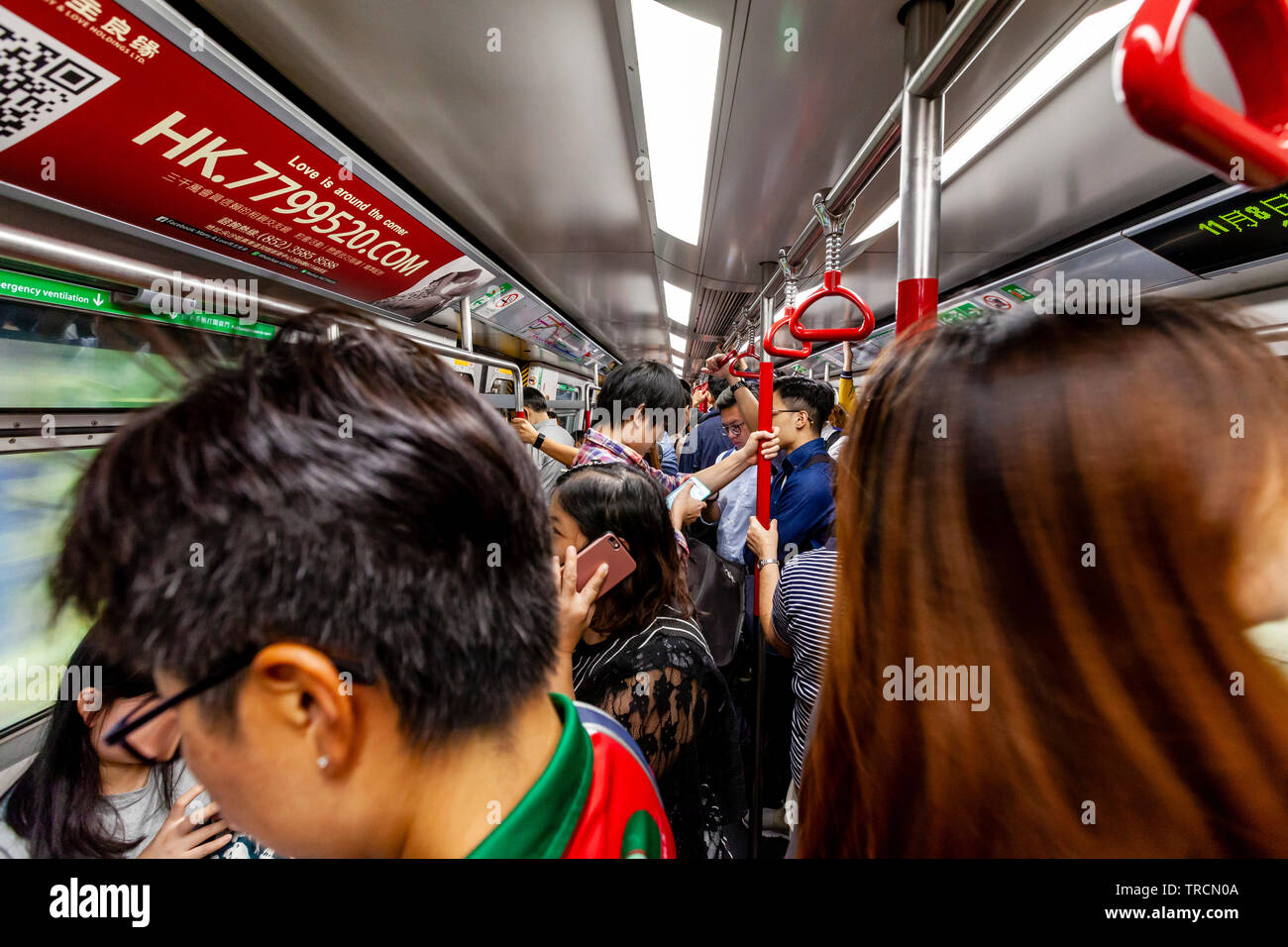 Passengers On A Busy MTR Train, Hong Kong, China Stock Photo - Alamy