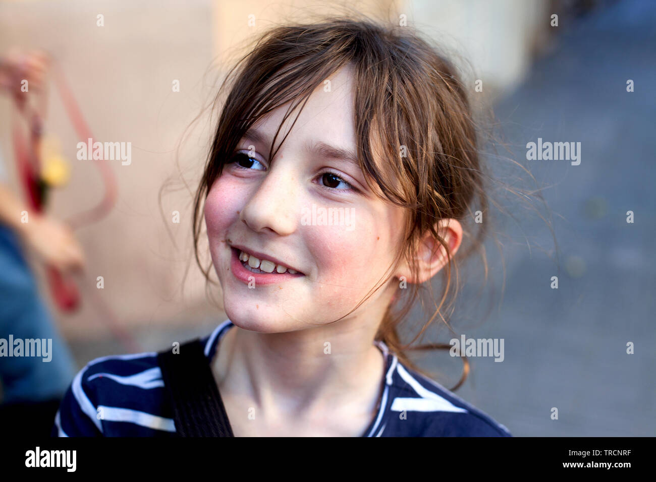 Boy in street smiling Stock Photo - Alamy