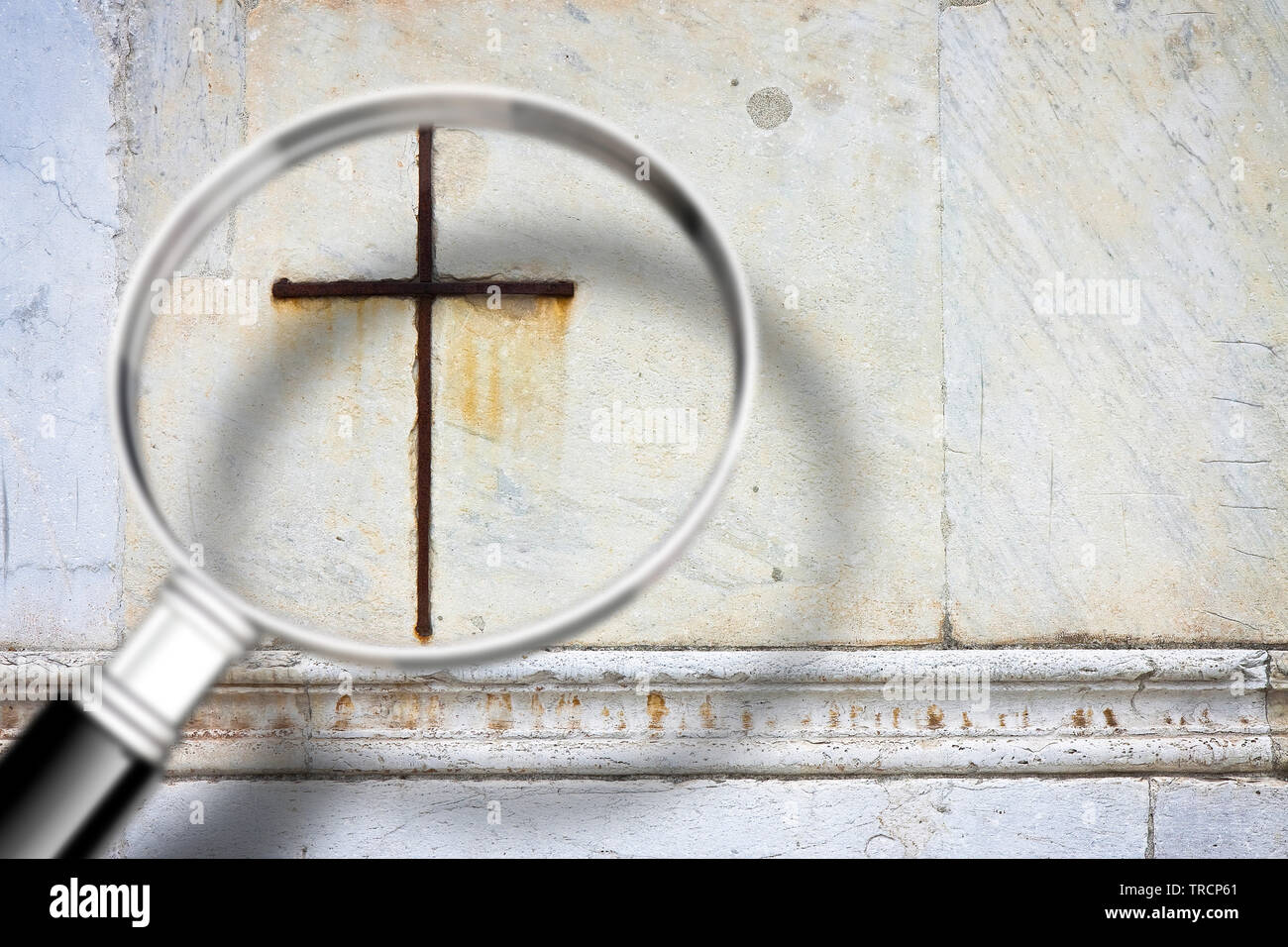 Looking for faith - concept image with a magnifying glass in front of a ...