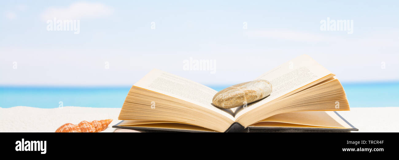 Book on the beach with white sand. Background for banner Stock Photo ...