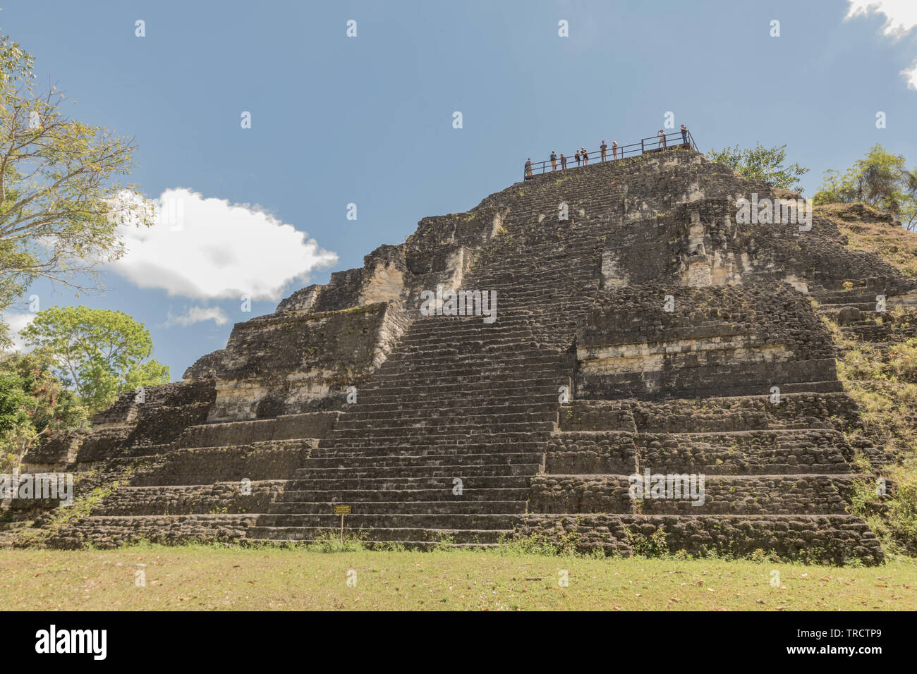 Ancient Mayan Pyramid with people standing at the top, in Tikal ...