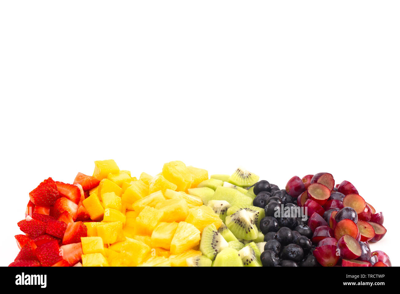 Lines of Rainbow Colored Fruit Isolated on a White Background Stock ...