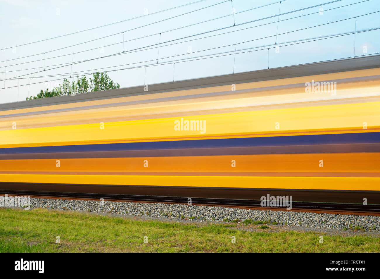 Dutch railway train with speed, with long exposure Stock Photo - Alamy