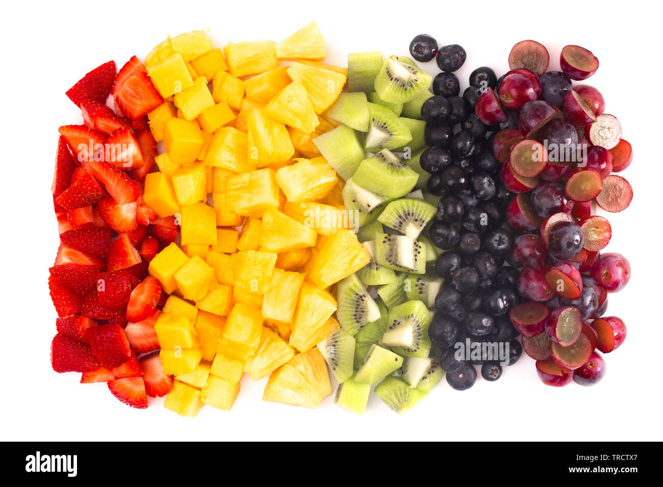 Lines of Rainbow Colored Fruit Isolated on a White Background Stock ...