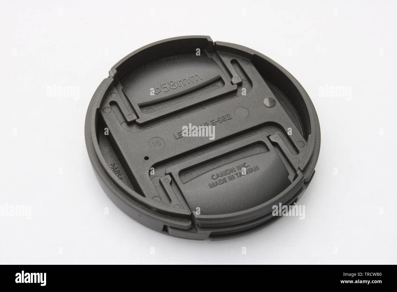 Canon camera lens cap black isolated on white background Stock Photo - Alamy