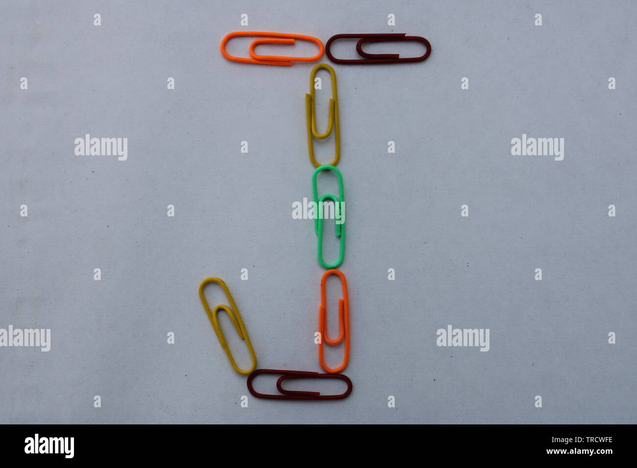 Letter J made with colorful paper clips on white background Stock Photo ...