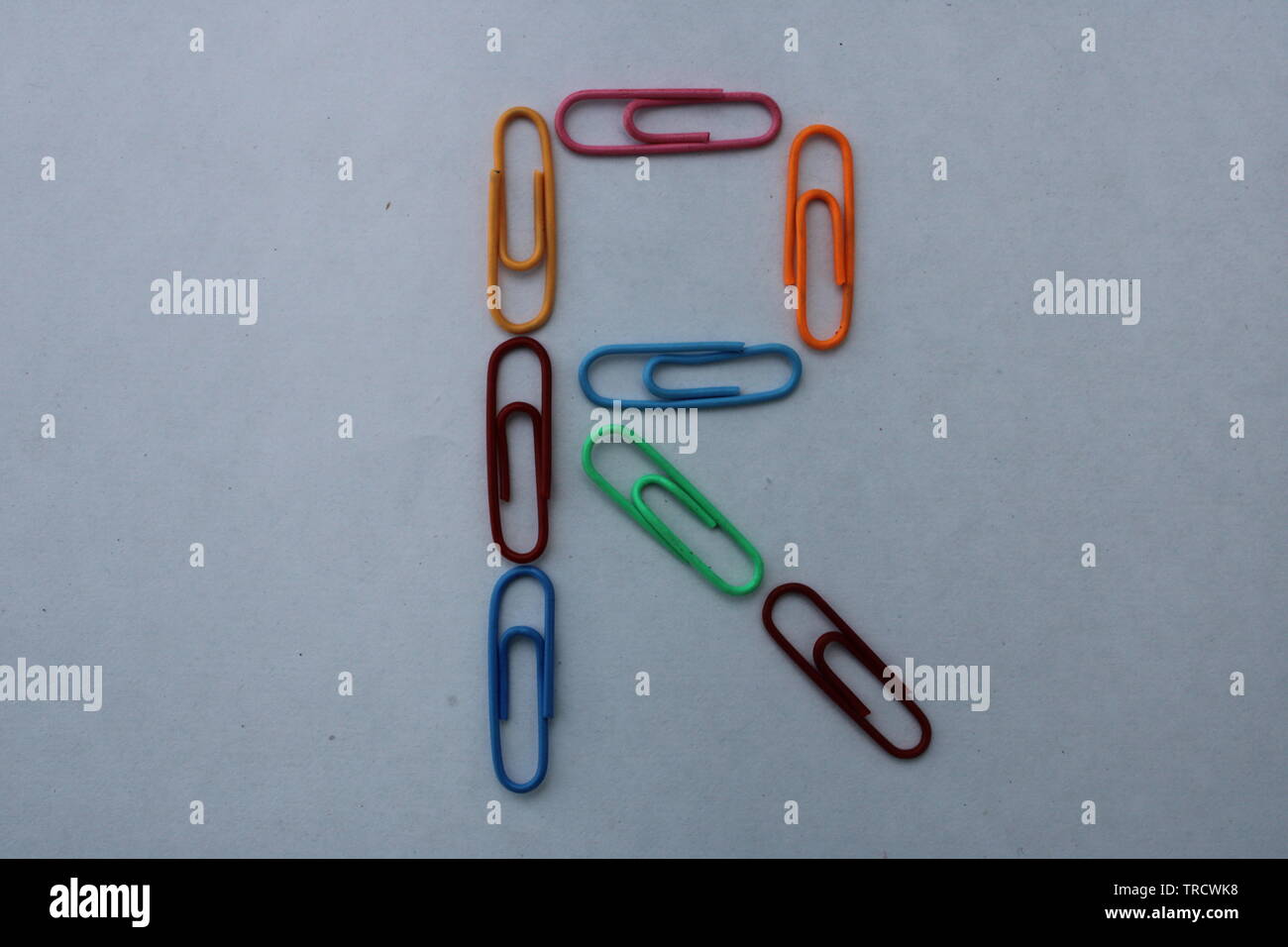 Letter R made with colorful paper clips on white background Stock Photo ...