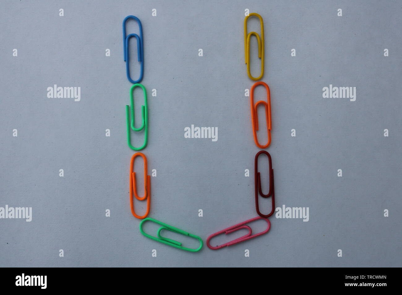 Letter U made with colorful paper clips on white background Stock Photo ...
