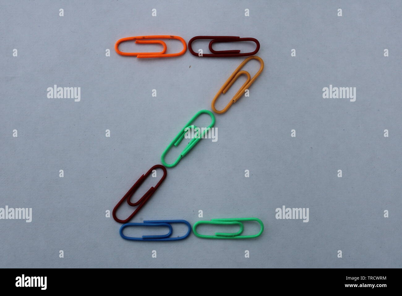 Letter Z made with colorful paper clips on white background Stock Photo ...
