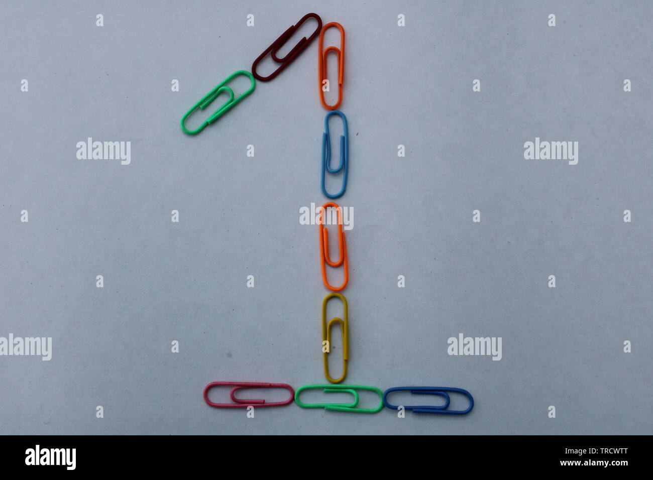 Number 1 made with colorful paper clips on white background Stock Photo ...