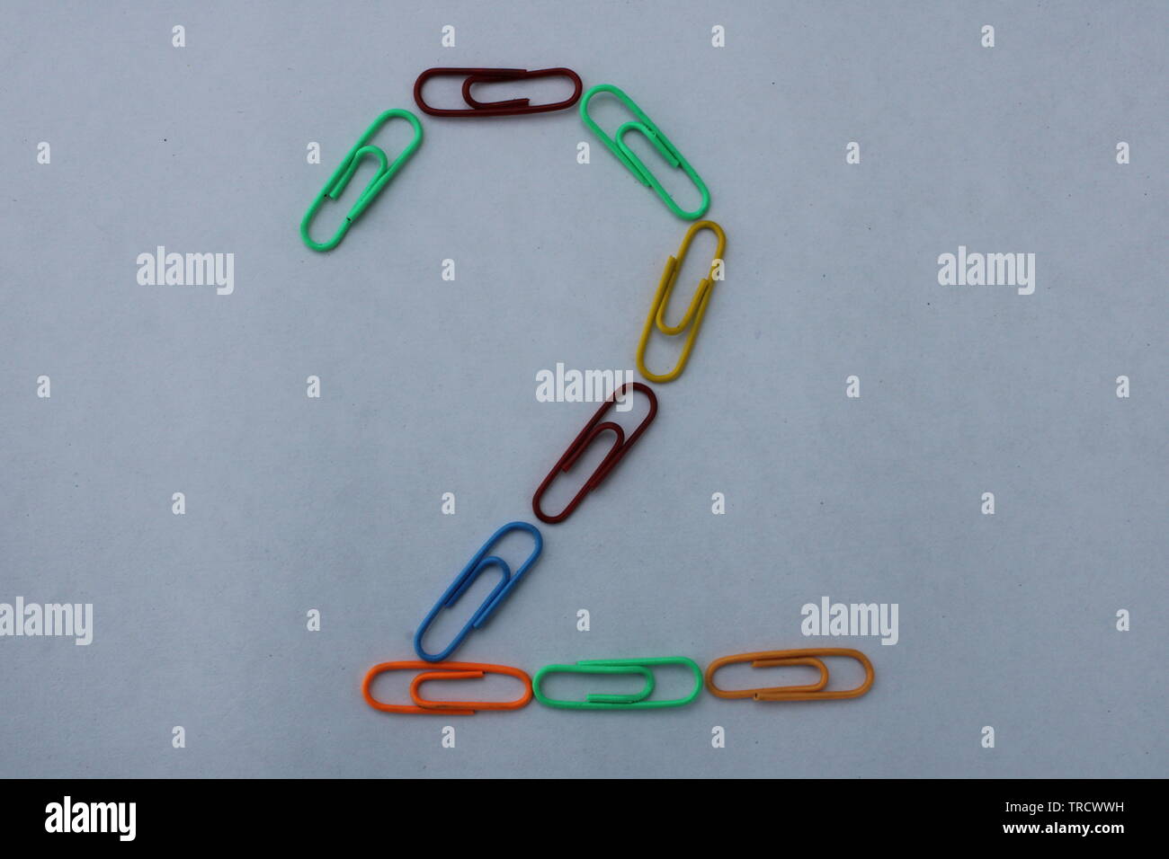 Number 2 made with colorful paper clips on white background Stock Photo ...