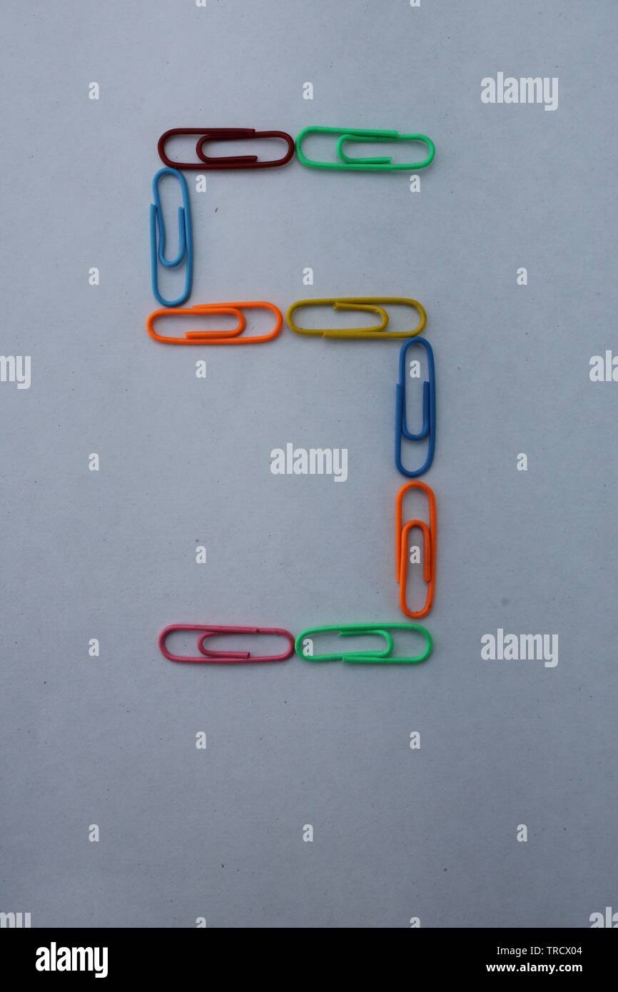 Number 5 made with colorful paper clips on white background Stock Photo ...