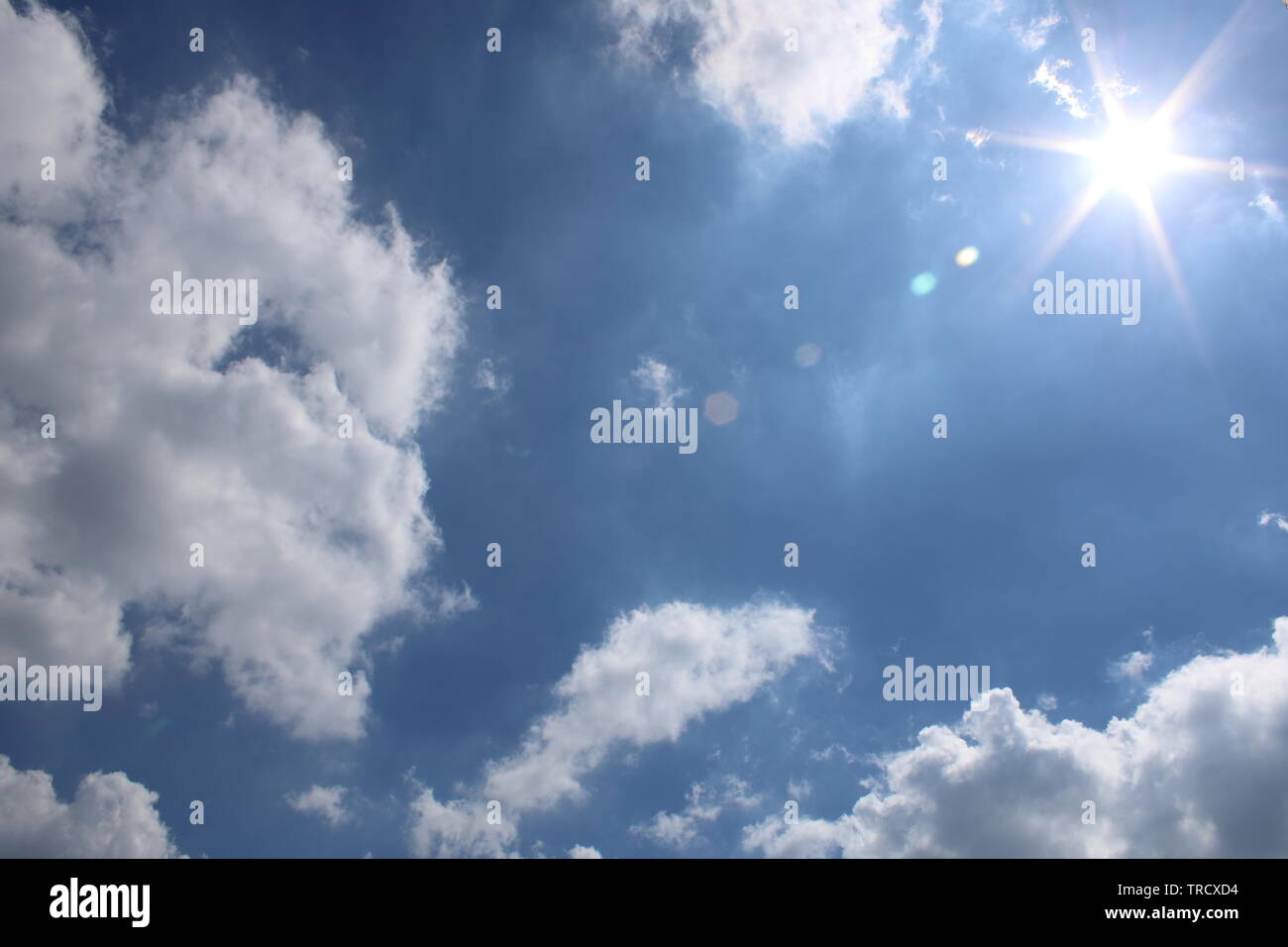 Blue sky with sun cloud lens flare Stock Photo - Alamy