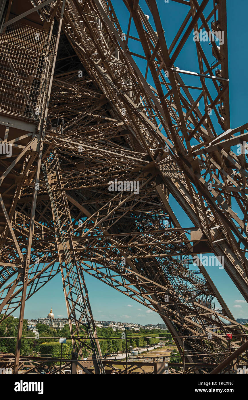 View of internal iron structure of the Eiffel Tower, with sunny blue ...