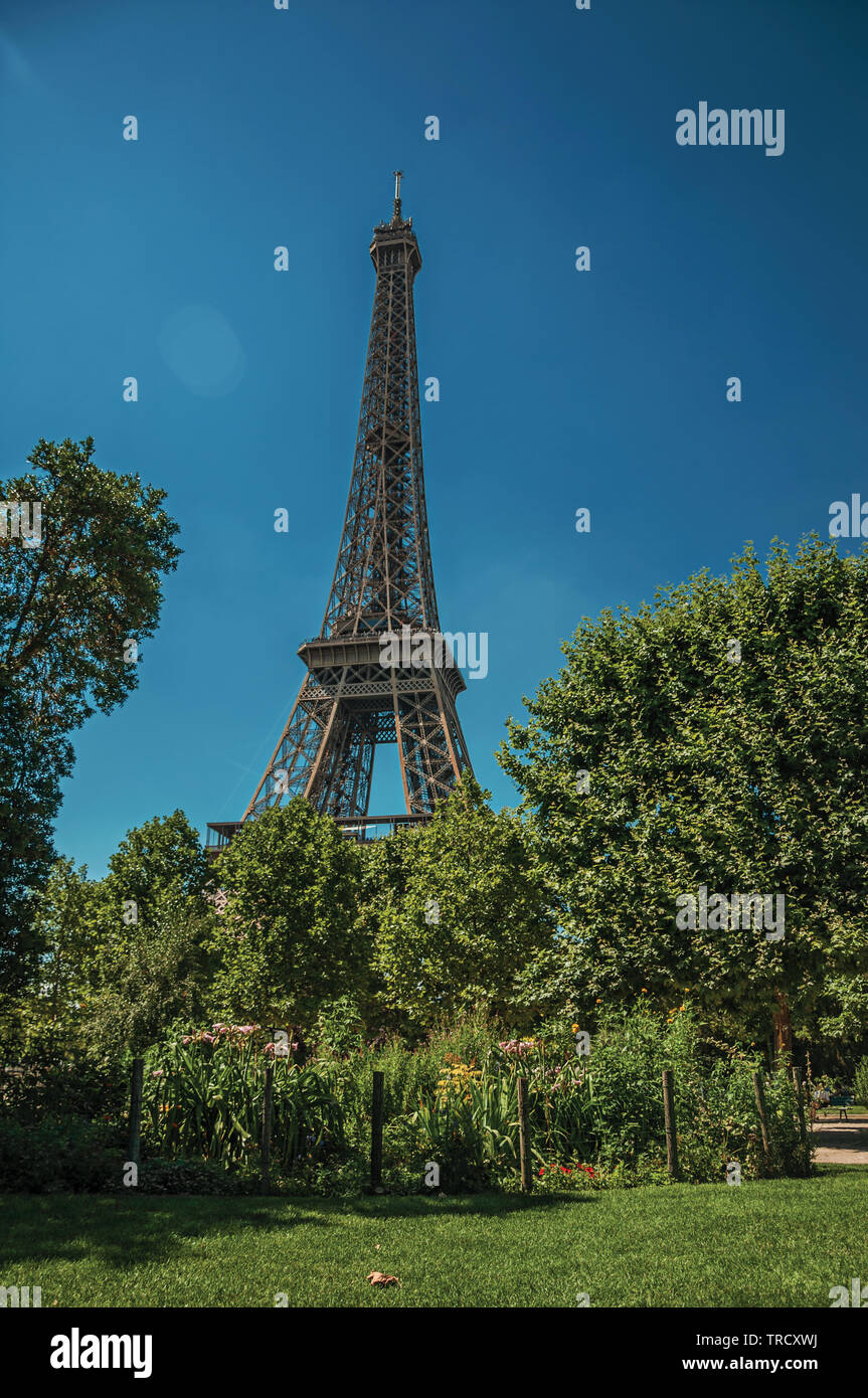 Overview of stunning Eiffel Tower and greenery under sunny blue sky in ...