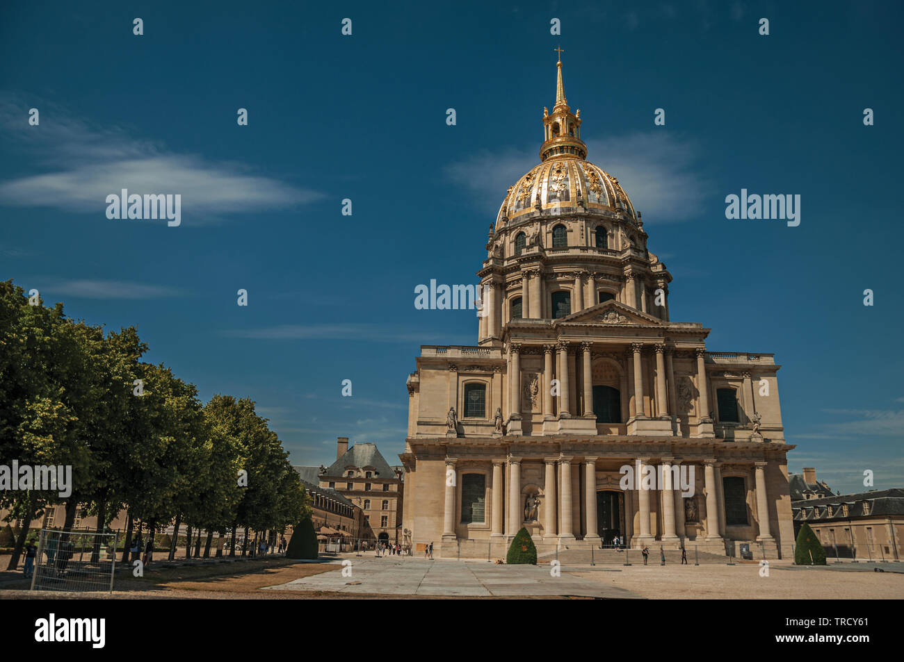 Trees and Front facade of Les Invalides Palace with the golden dome in ...
