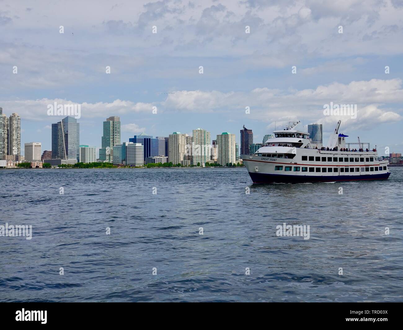 Great Point, cruise around New York, tourist boat with many people on ...