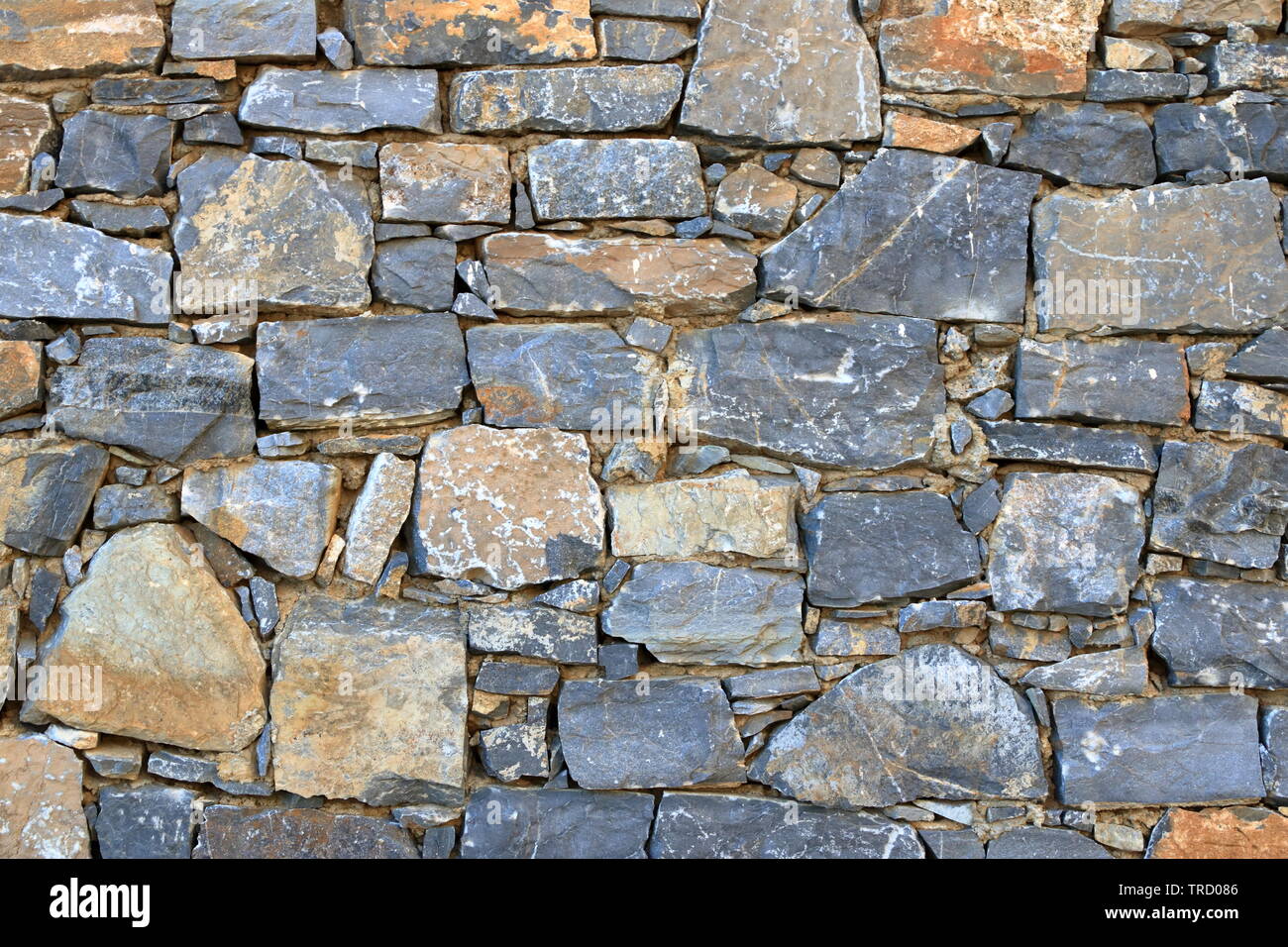 Big gray wall made from stone bricks Stock Photo - Alamy