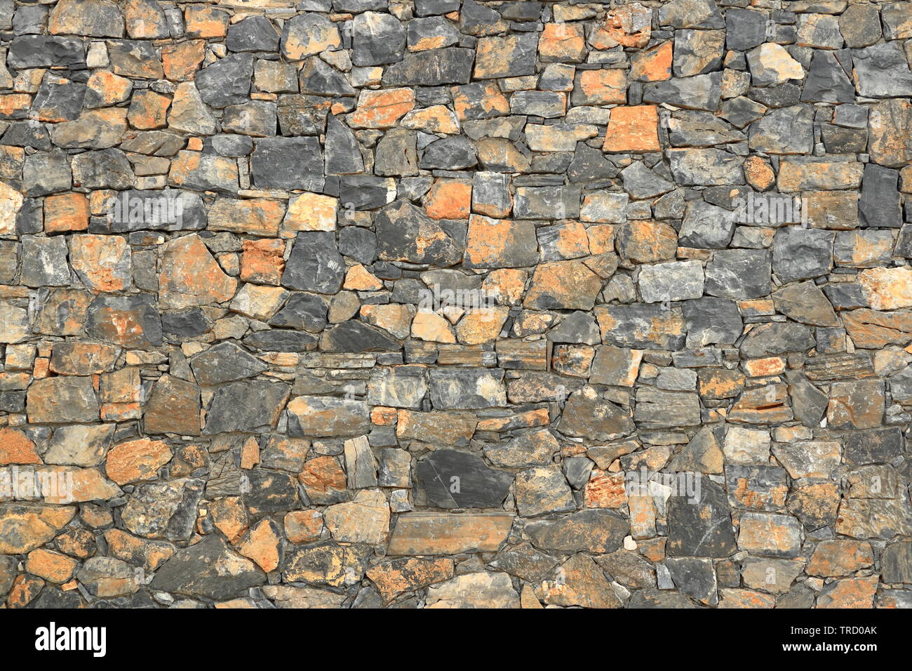 Big gray wall made from stone bricks Stock Photo - Alamy