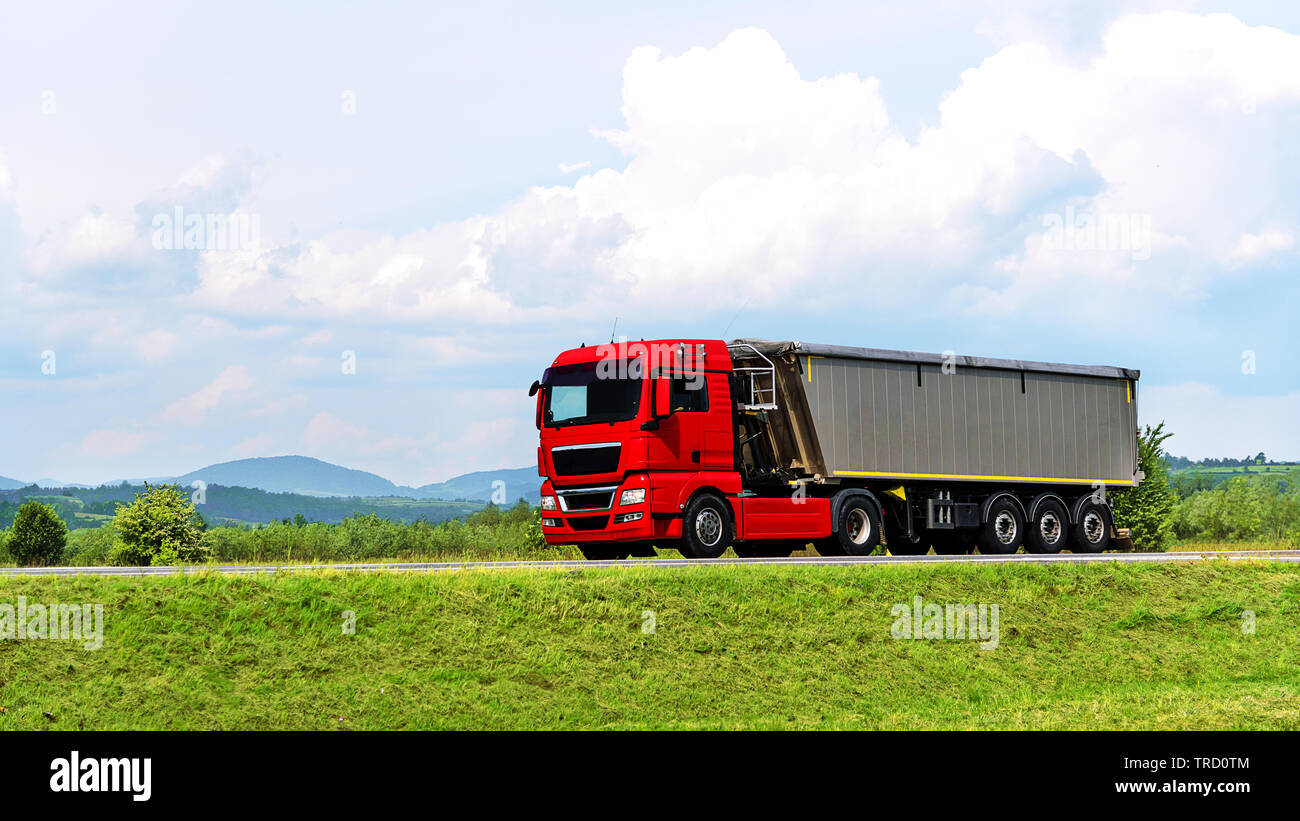 Transportation industry concept - modern red generic truck with load ...