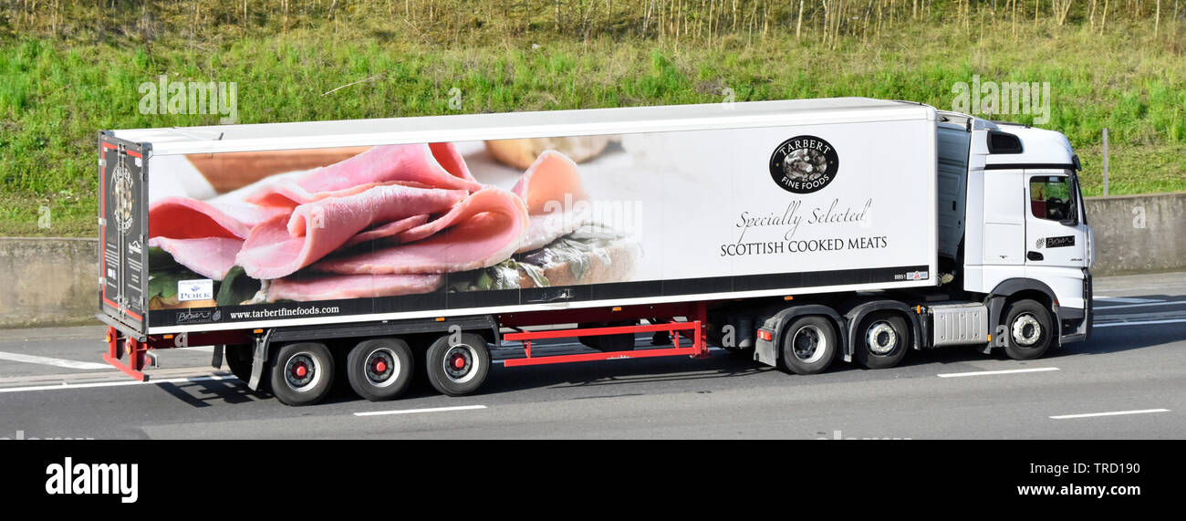 Side view of white hgv lorry truck & a food supply chain articulated ...