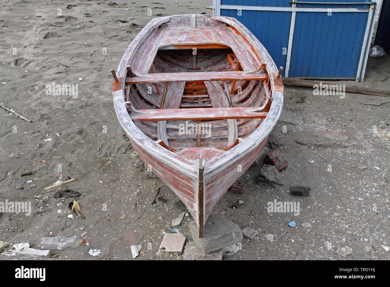 Small Wooden Dinghy Boat Repair at Beach Stock Photo - Alamy