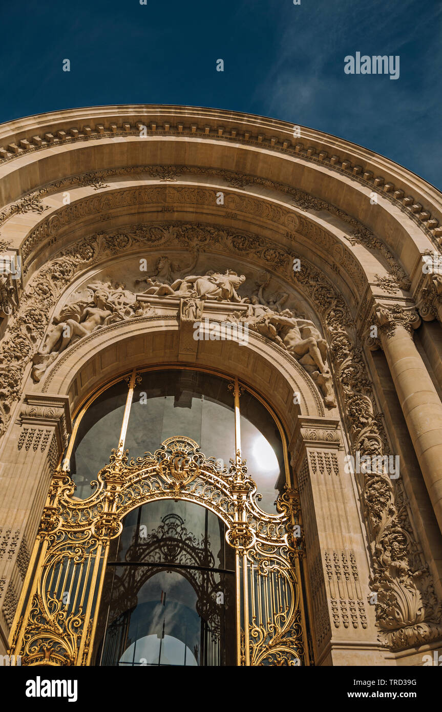 Far-fetched golden gate and arch in a sunny day at the Petit Palais in ...