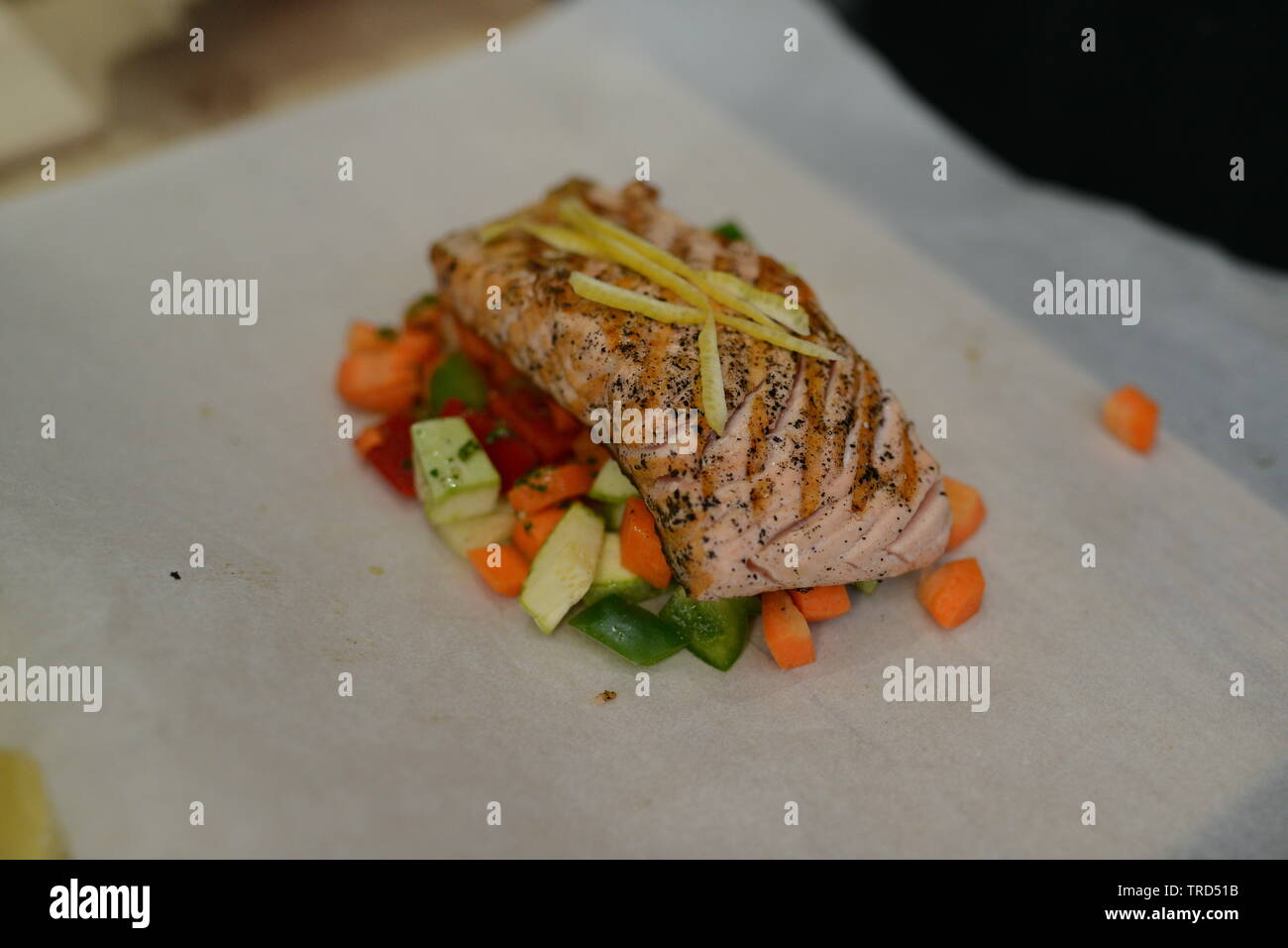 Served fish fillets with vegetables in a restaurant Stock Photo - Alamy