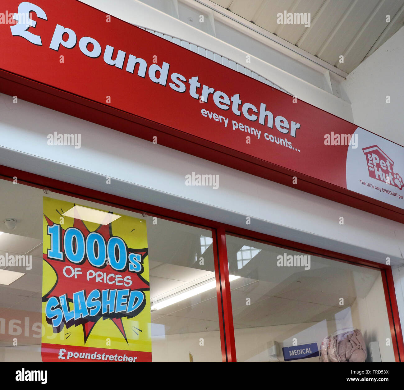 Window of Poundstretcher store with prices slashed sign and ...